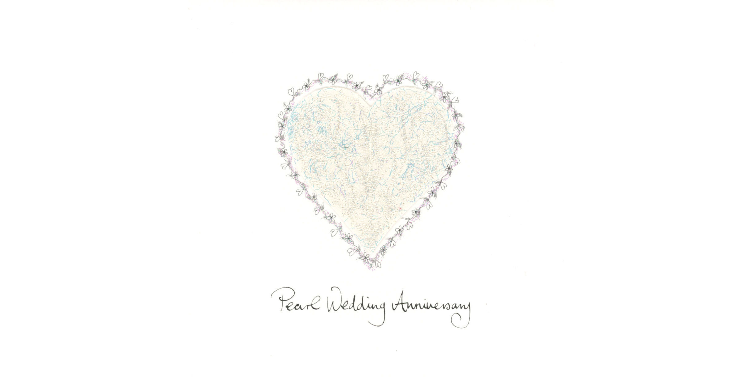An embroidered ivory heart created on white satin with iridescent ...